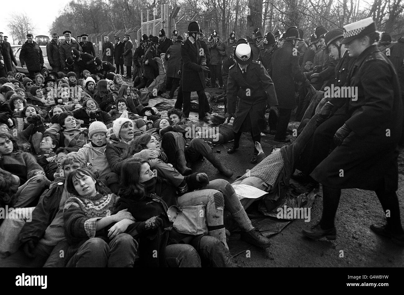 Police dragging away anti-nuclear demonstrators at the Greenham Common ...