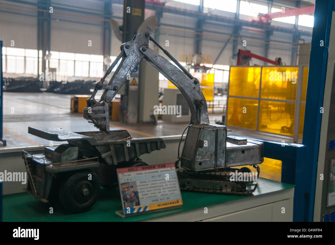 A model of a crawler excavator and mining truck done by XCMG employees ...