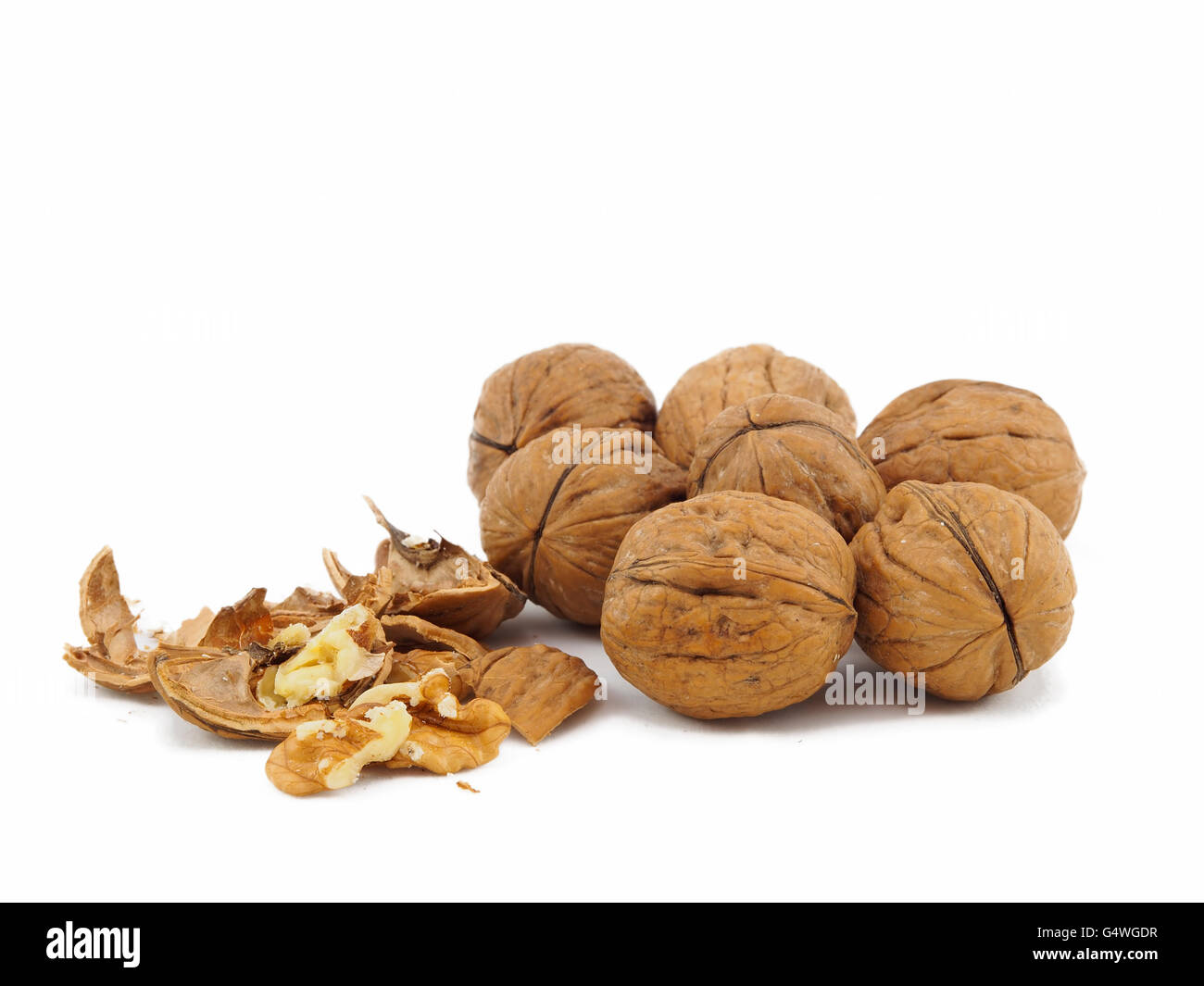 Group of walnuts plus a broken one Stock Photo - Alamy
