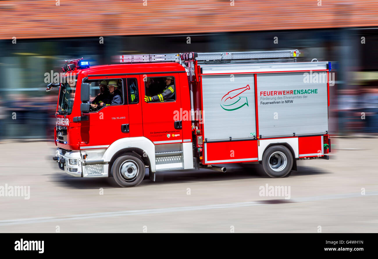 Fire fighters, during an exercise, fire truck Stock Photo - Alamy