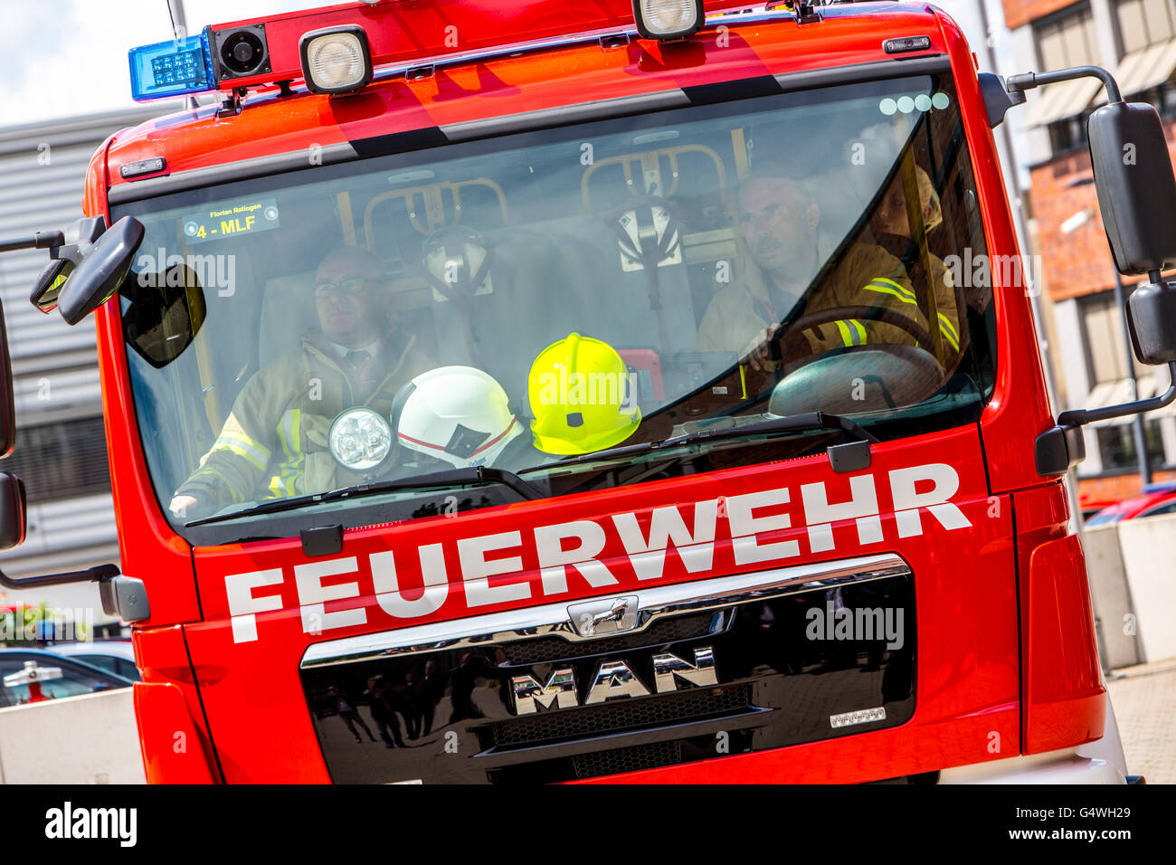 Fire fighters, during an exercise, fire truck Stock Photo - Alamy