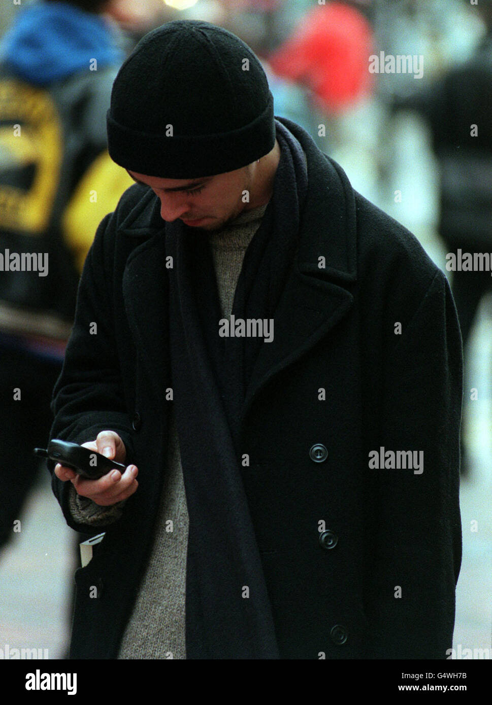 A man uses his mobile phone, Britain's fastest growing gadget, with 24 ...