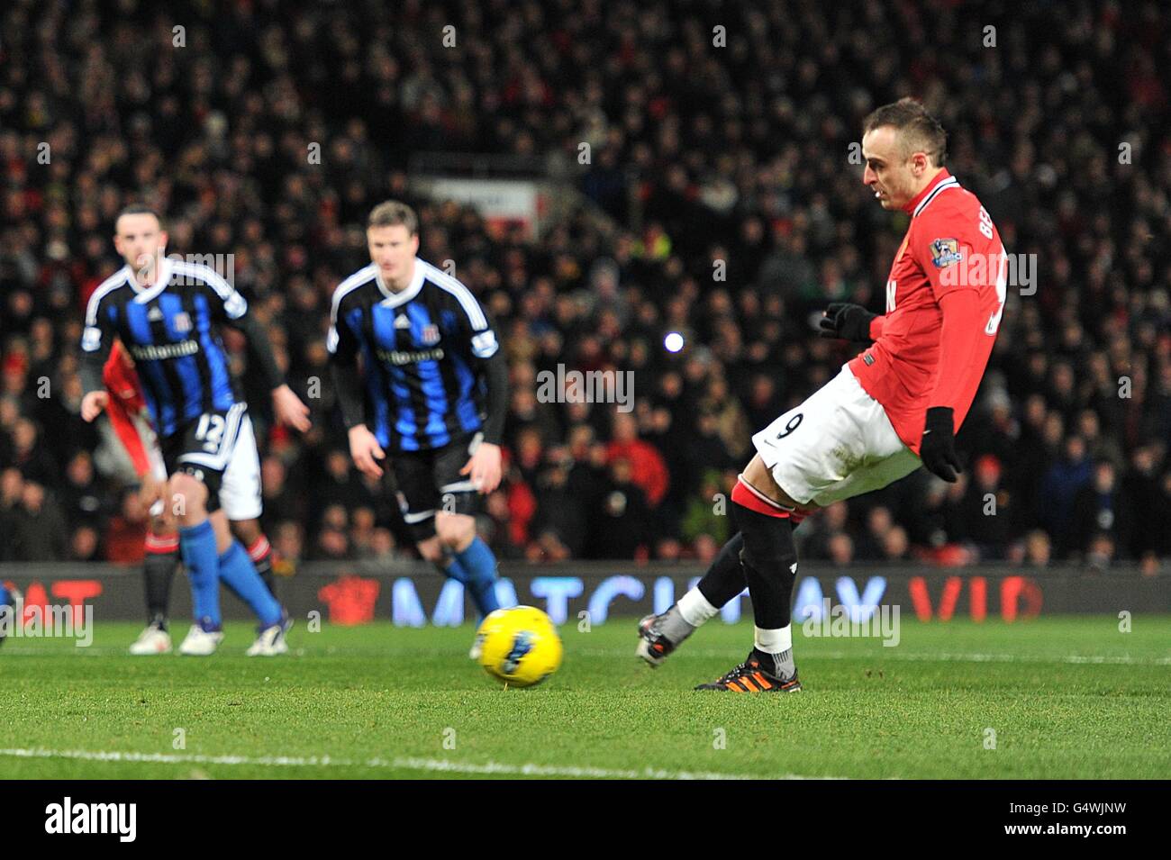 Manchester United's Dimitar Berbatov (right) scores their second goal ...
