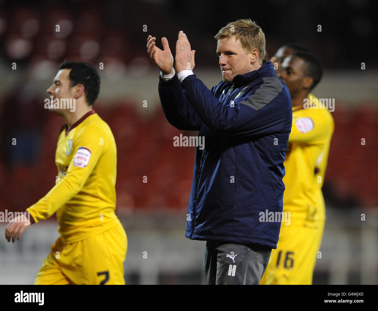 Burnley's manager Eddie Howe applauds the traveling fans after victory ...