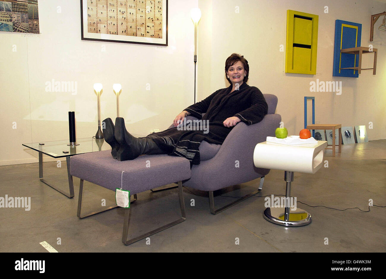 Cherie Blair tries out an armchair by British designer Matthew Hilton ...