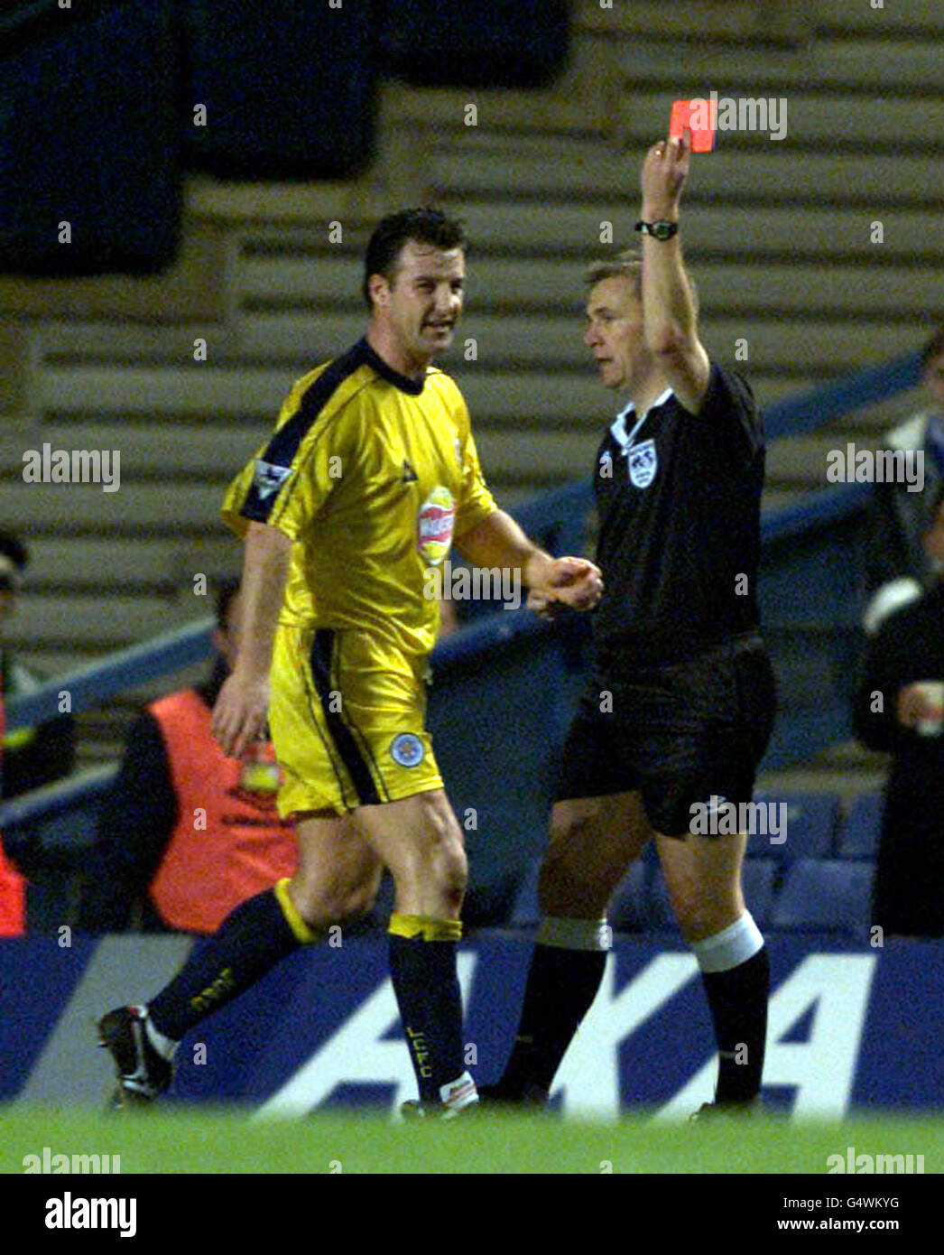 Leicester City's Steve Walsh is shown the red card by referee Graham ...