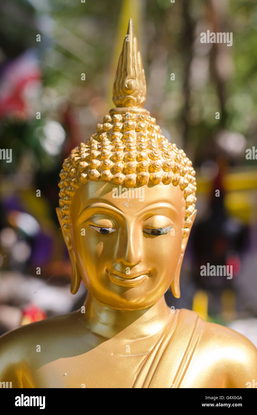 Closeup of golden buddha. Focus on eye Stock Photo - Alamy