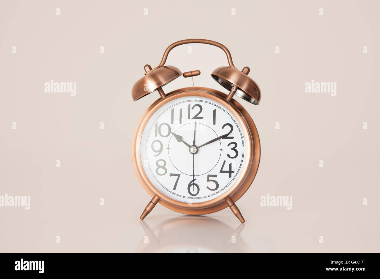 Retro alarm clock on a plain background closeup Stock Photo - Alamy