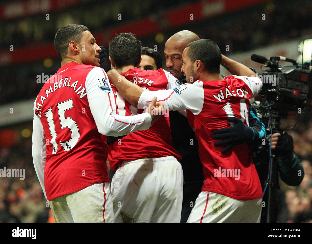 Arsenal's Robin Van Persie (centre) celebrates with team mates Alex ...
