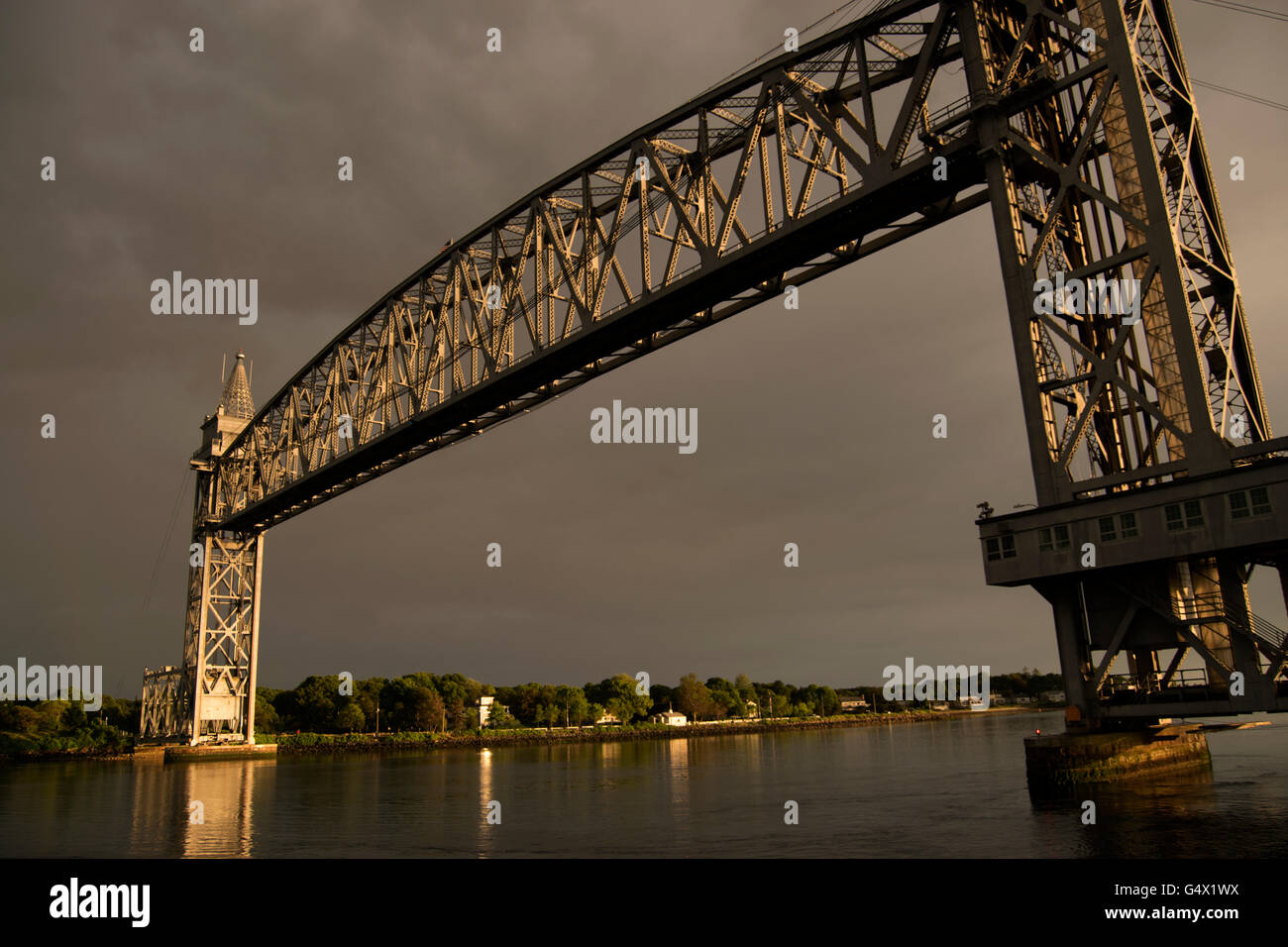 Cape Cod Canal railroad bridge at sunset on cloudy day Stock Photo - Alamy