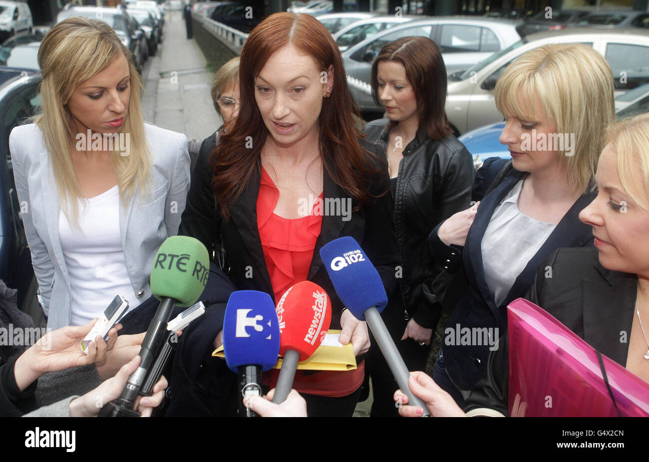 Jean Noctor (centre) reads a statement outside the Department of Heath ...