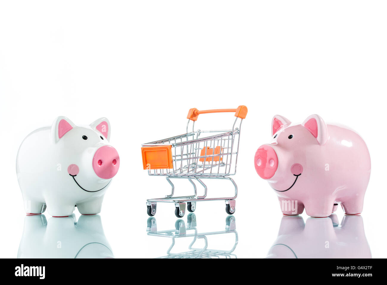 Piggy bank and a shopping trolley isolated on white background Stock ...