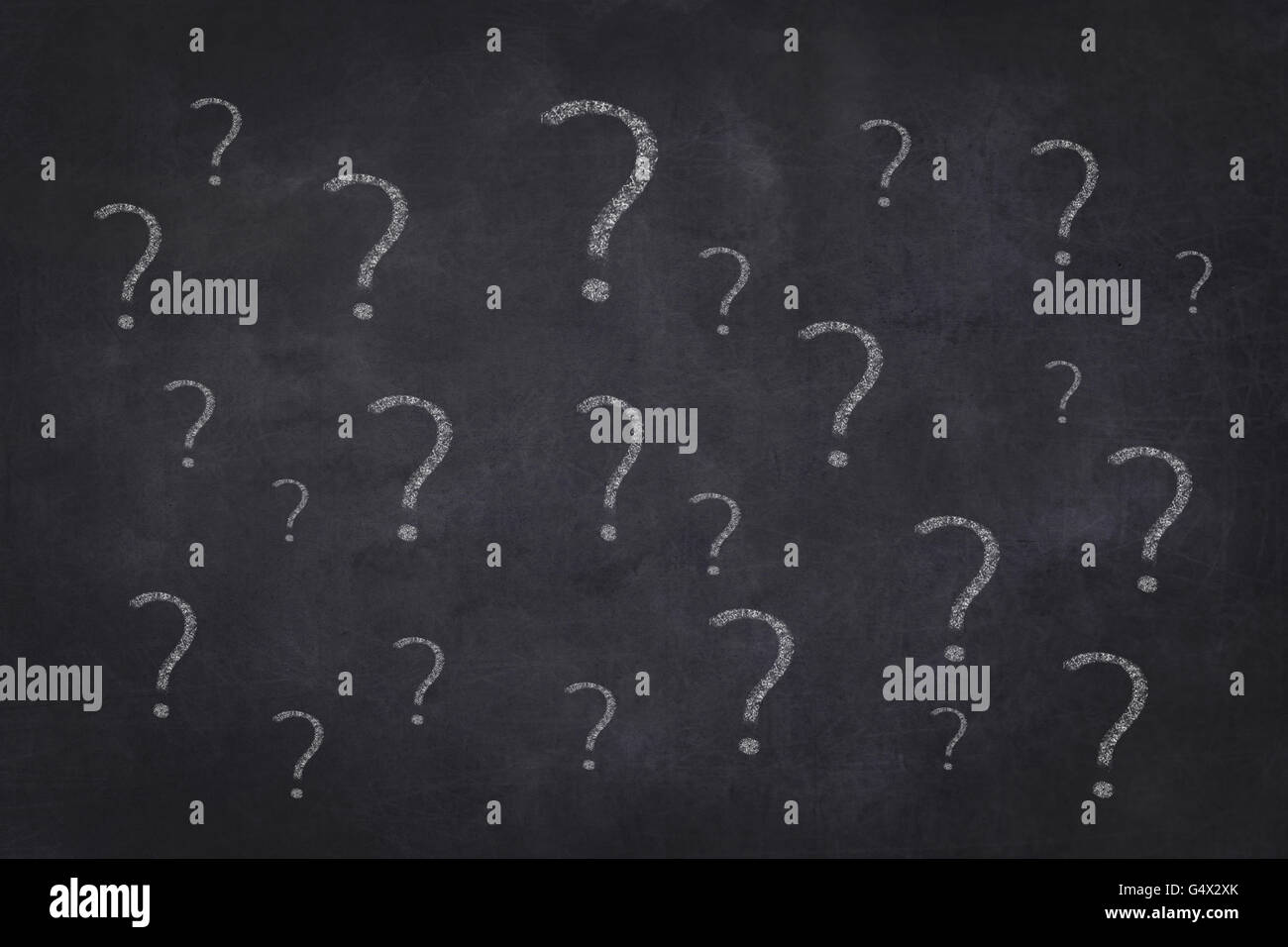 many question marks on chalkboard background Stock Photo - Alamy