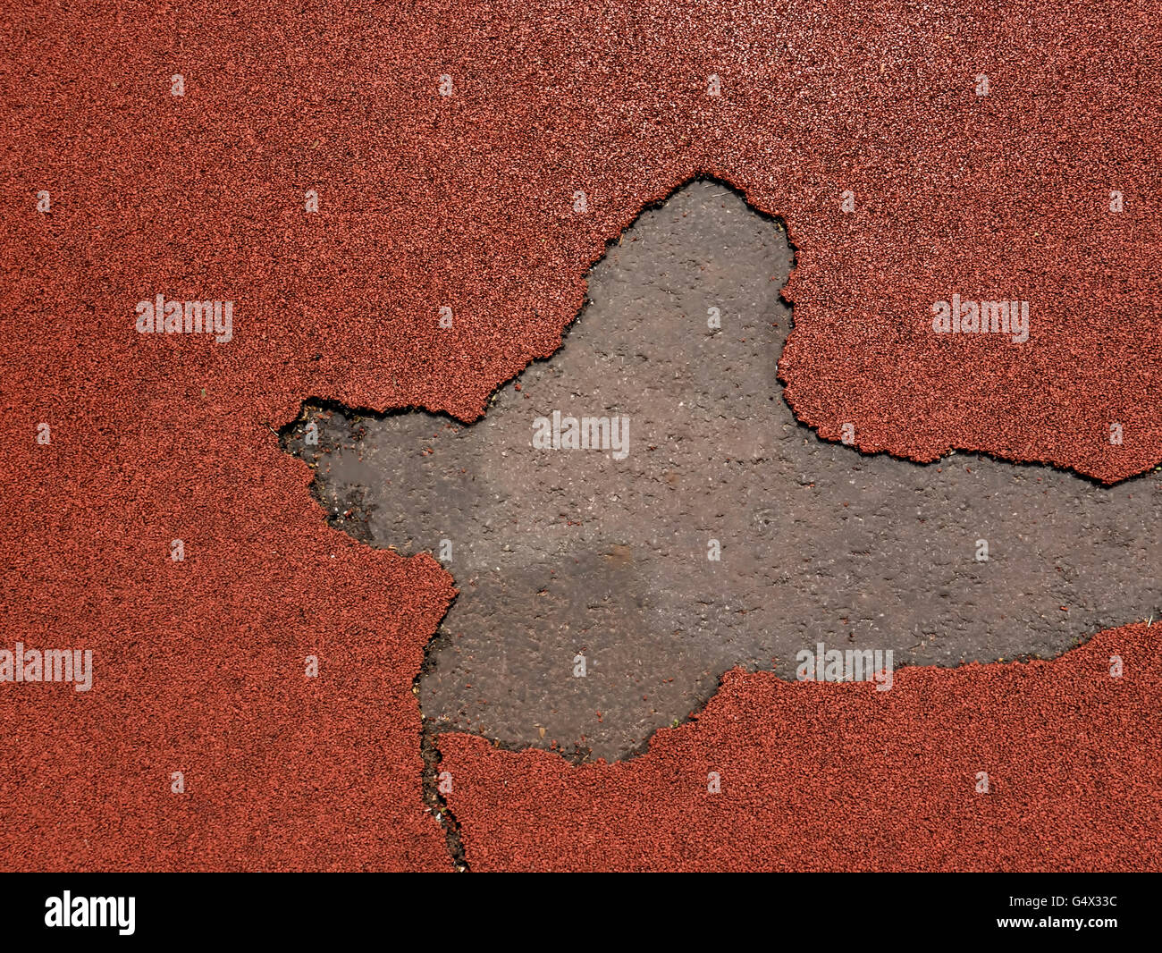 Damaged old protective rubber coating in children playground. Texture ...