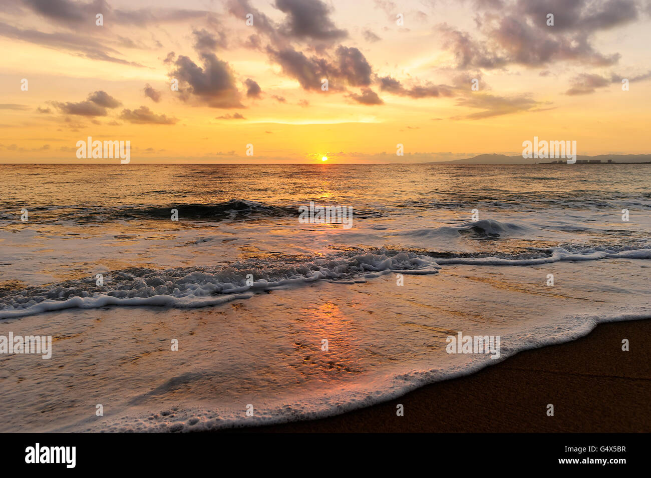 Ocean sunset is a brightly lit golden seascape with a gentle wave ...