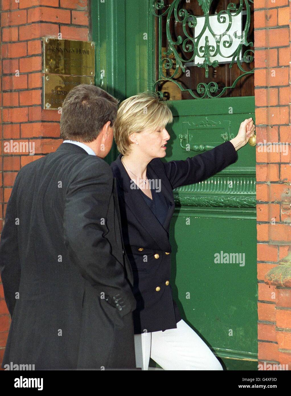 Sophie Rhys-Jones, the fiancee of Prince Edward, is escorted by a ...