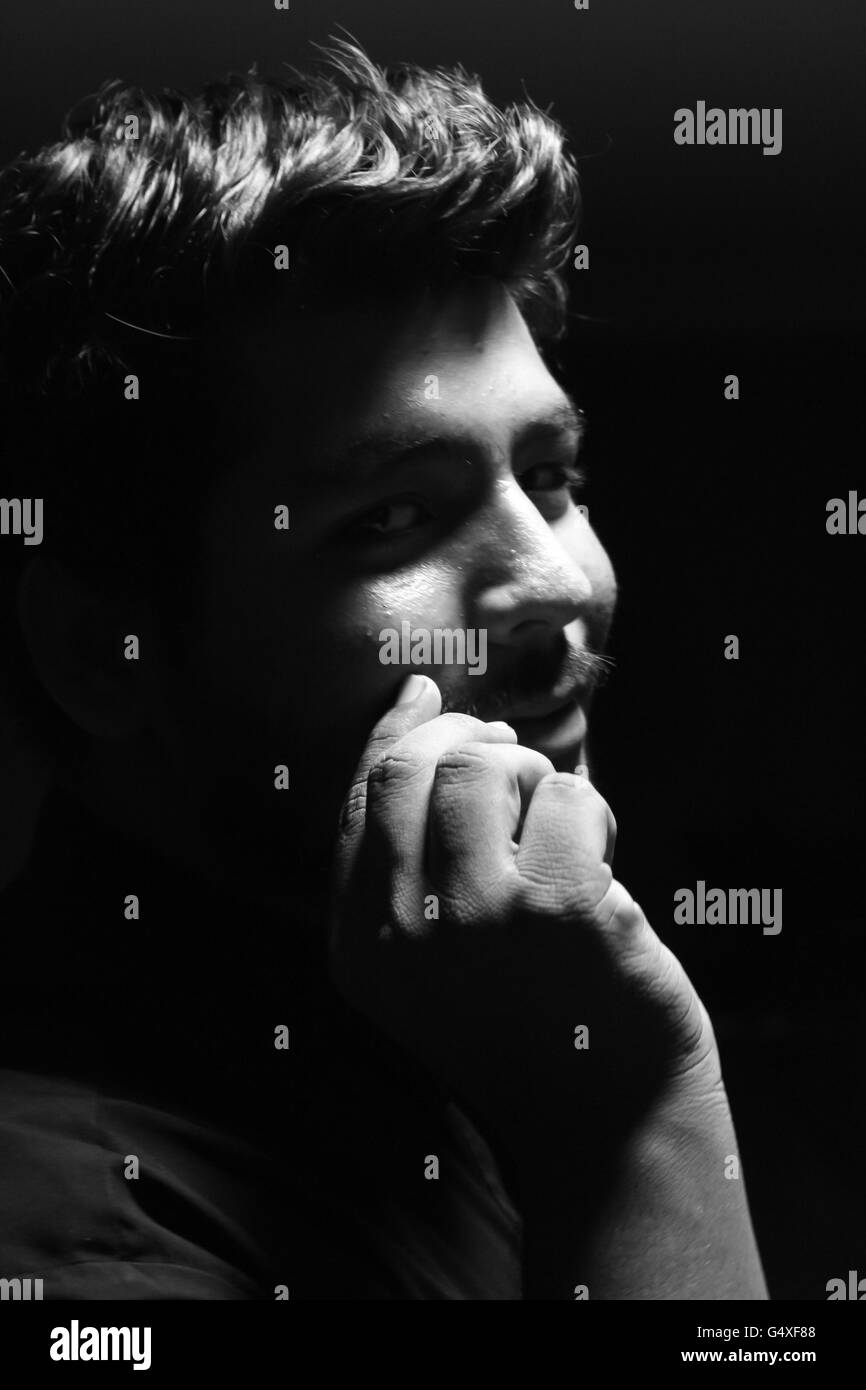 Boy under the light Stock Photo - Alamy