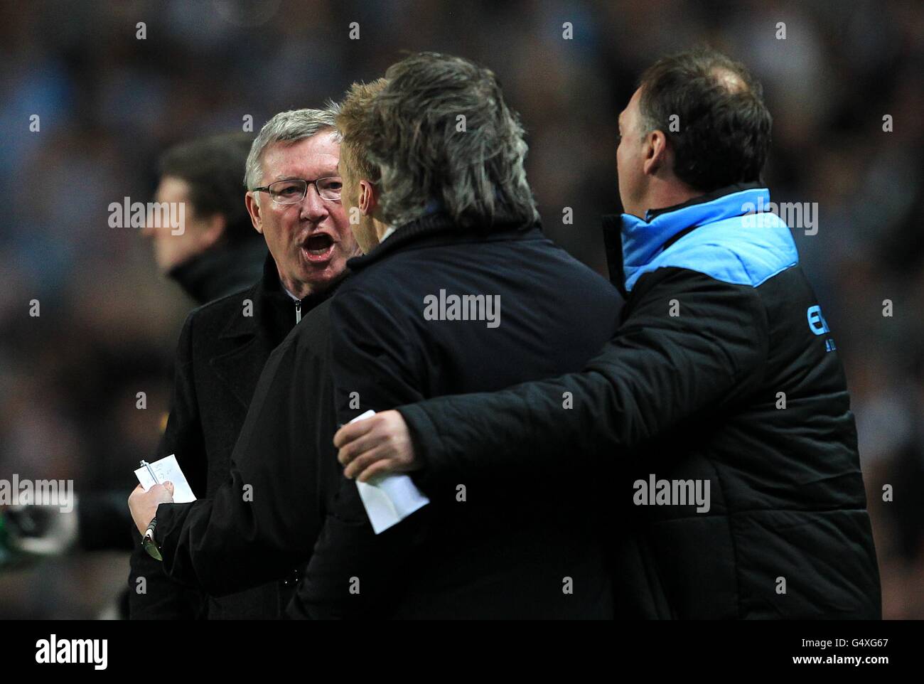 Manchester City manager Roberto Mancini (cente) and Manchester United ...