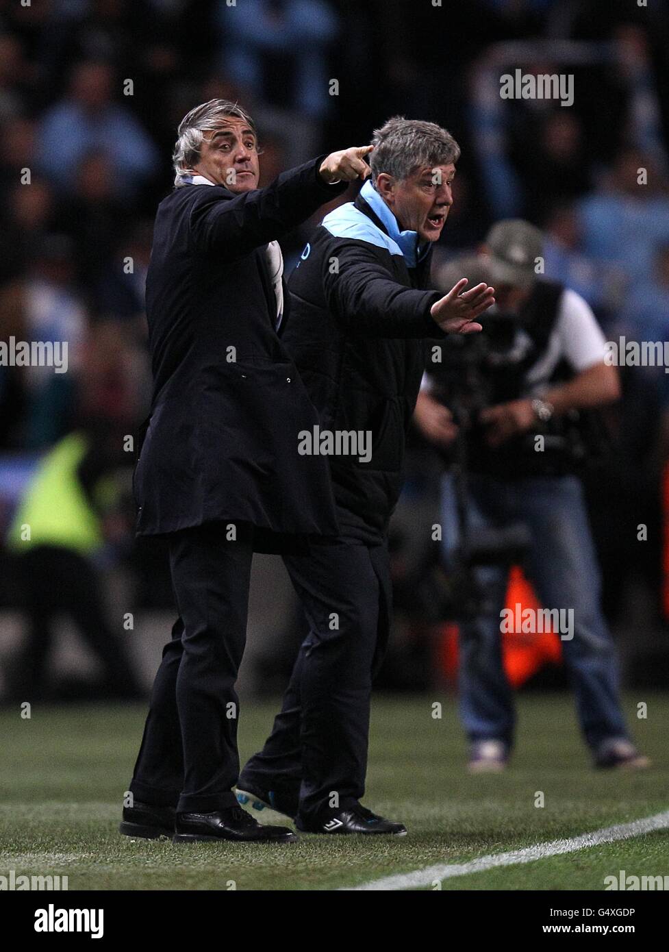 Manchester citys manager roberto mancini left his assistant brian kidd ...
