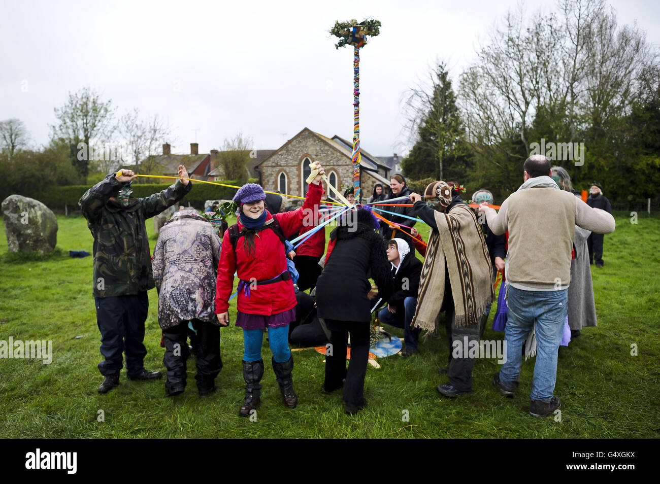As dancers weave around the maypole at avebury stone circle hi-res ...