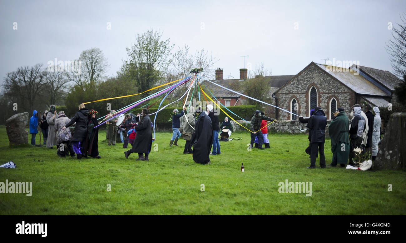 As dancers weave around the maypole at avebury stone circle hi-res ...