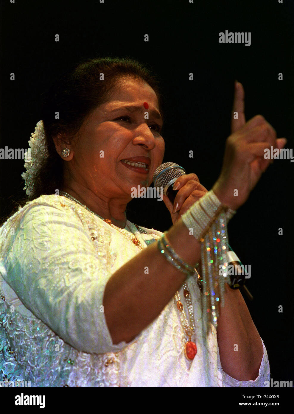 Indian singer Asha Bhosle performing on stage in concert at Wembley ...