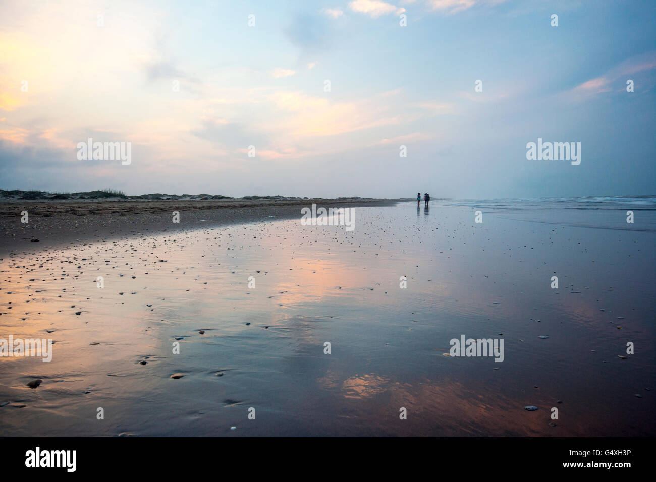 Reflections on beach sunrise hi-res stock photography and images - Alamy