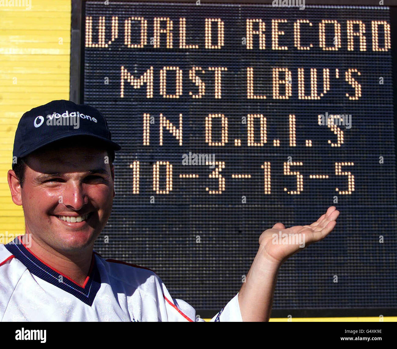 England's Mark Ealham stands by the scoreboard with his record breaking ...