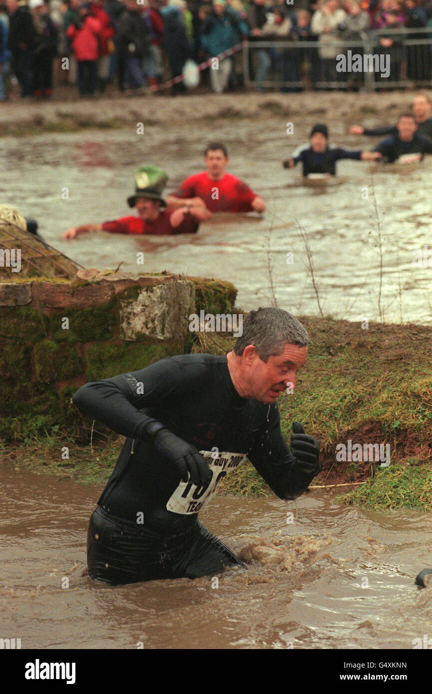 A competitors feels the cold whilst taking part in the Tough Guy 2000 ...