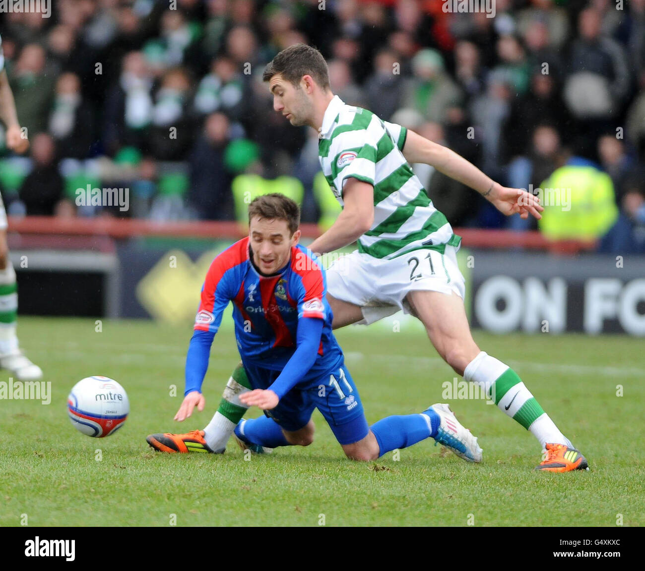 Inverness' Nick Ross takes a tumble under pressure from Celtic's ...