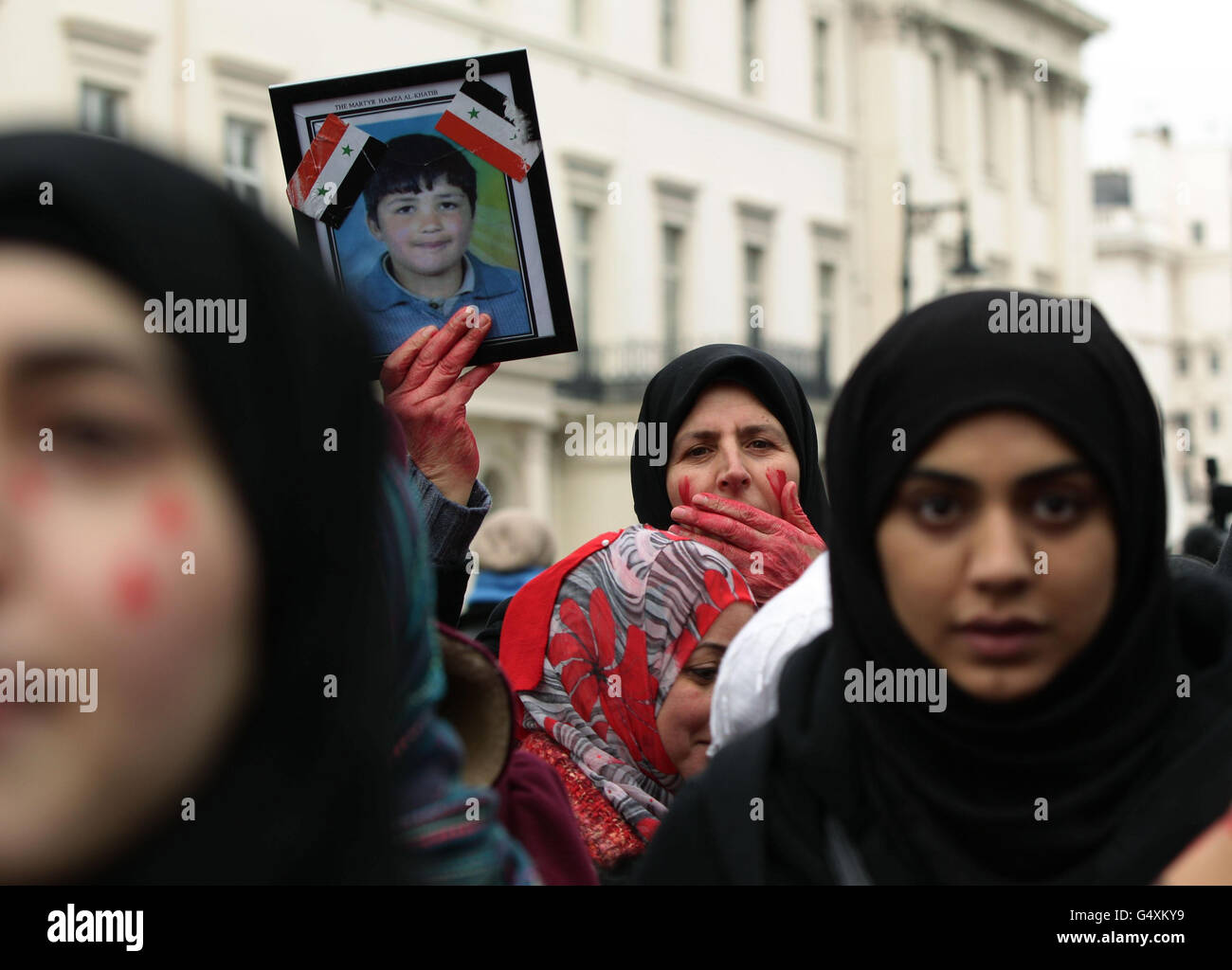 Protesters outside the Syrian Embassy in central London, amid reports ...