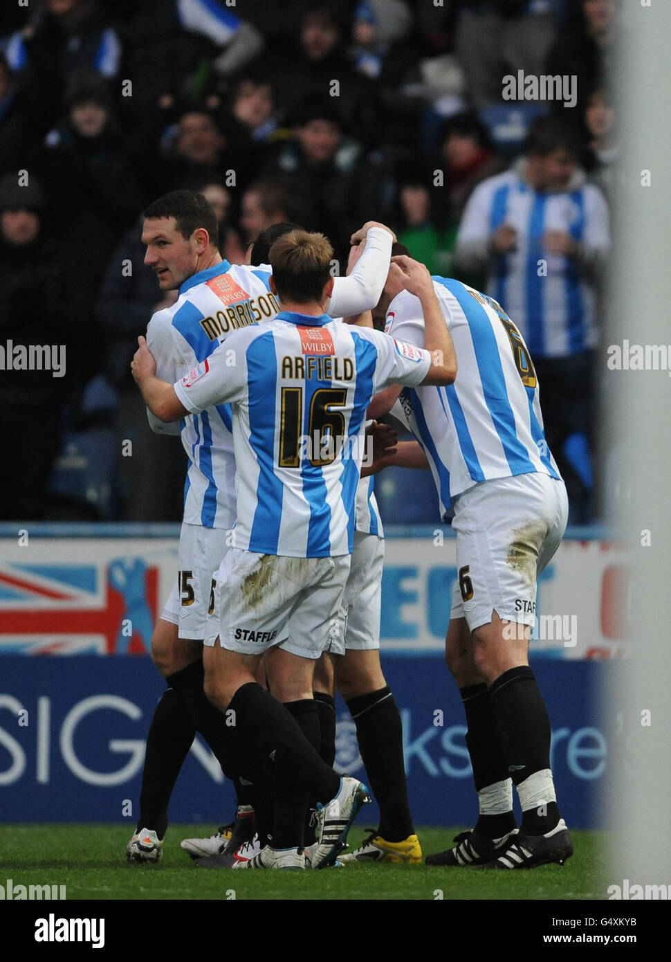 Huddersfield Town's Jamie McCombe (right) is congratulated by teammates ...