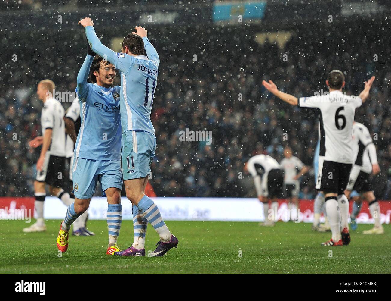 Manchester City's David Silva (left) and Adam Johnson (centre ...