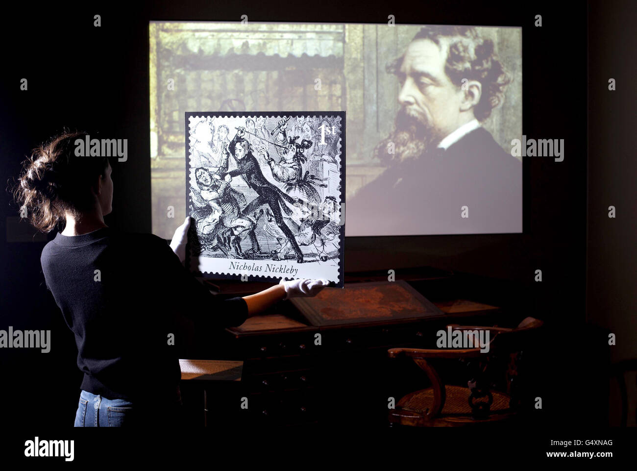 Caroline Stephenson holds an enlarged stamp of Nicholas Nickleby, from ...