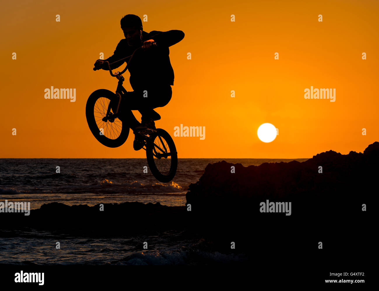 extreme sport bmx, jump on a sunset background Stock Photo - Alamy