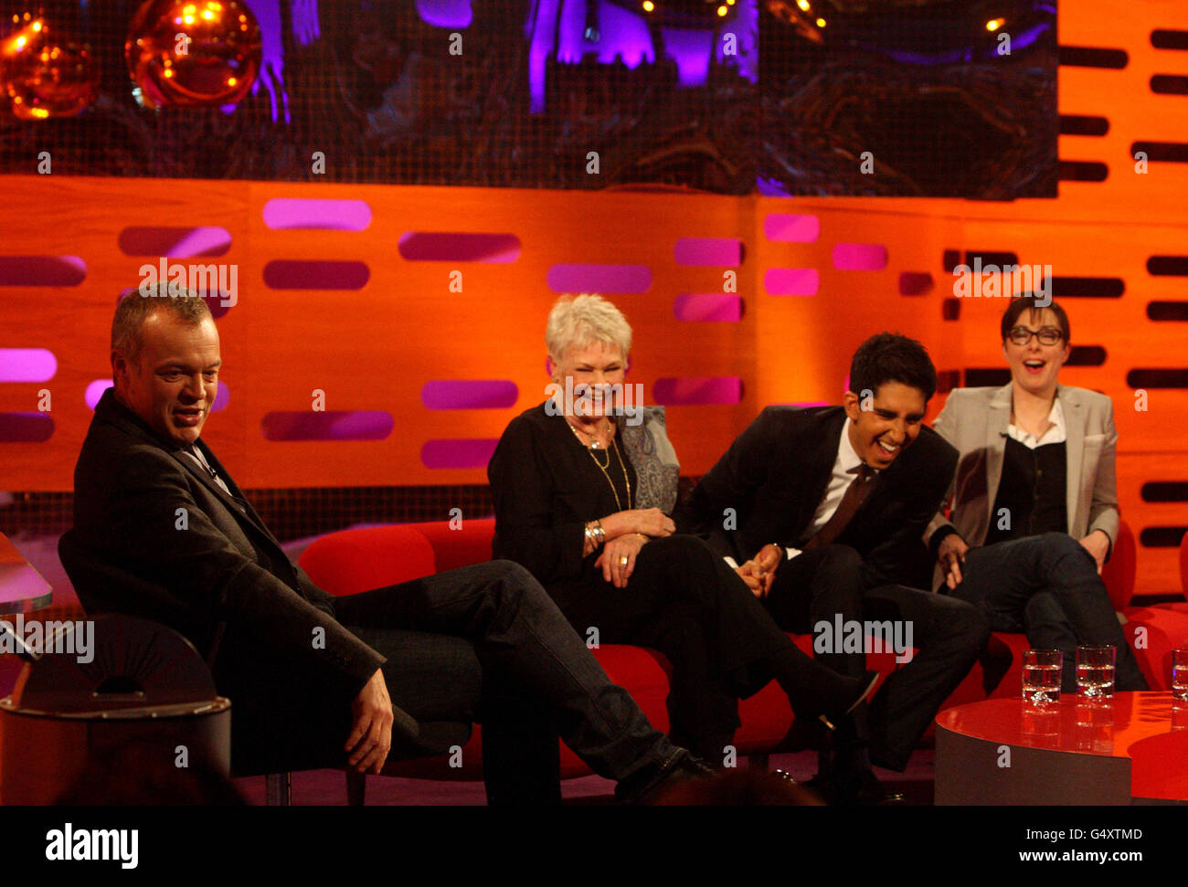 (left to right) Graham Norton, Dame Judi Dench, Dev Patel and Sue ...