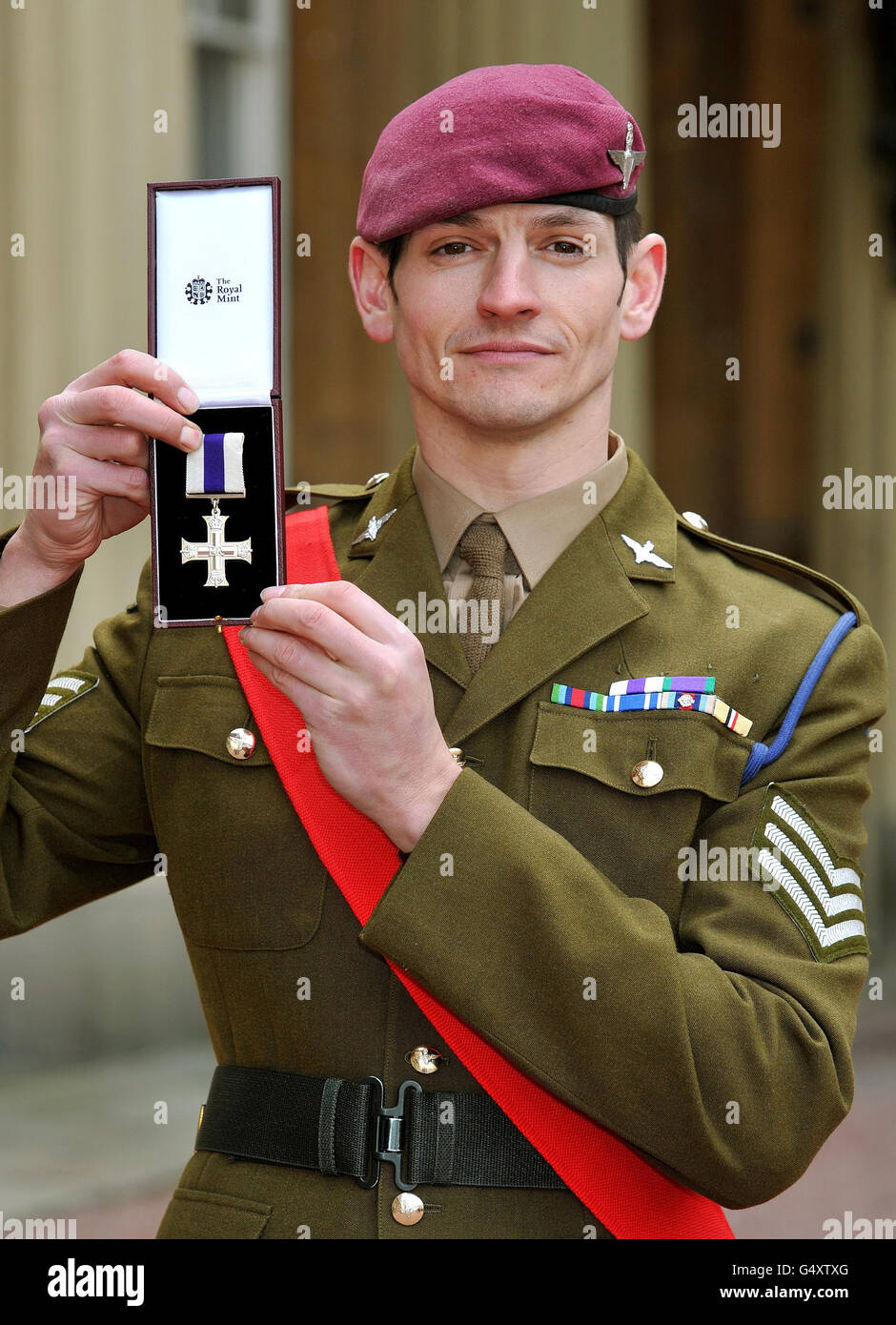 Sergeant Glen Gardiner of the Parachute Regiment proudly holds his ...