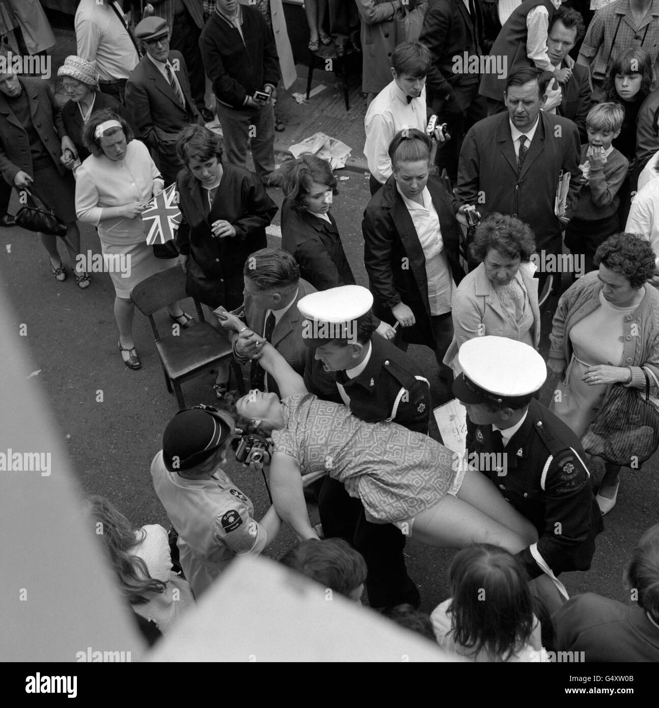 Fainting Woman Carried