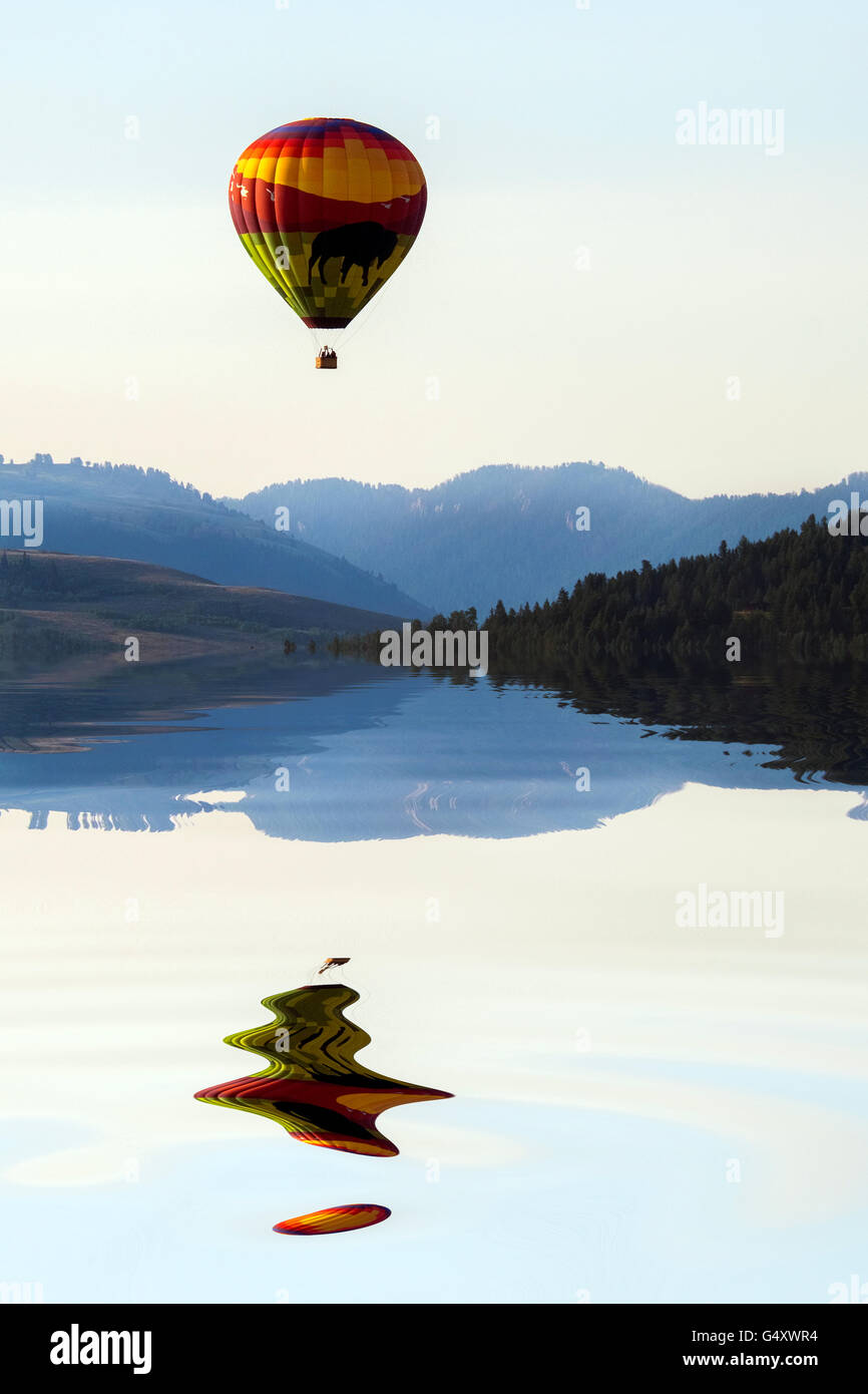 Hot air balloon floating over digitally created water with balloon ...