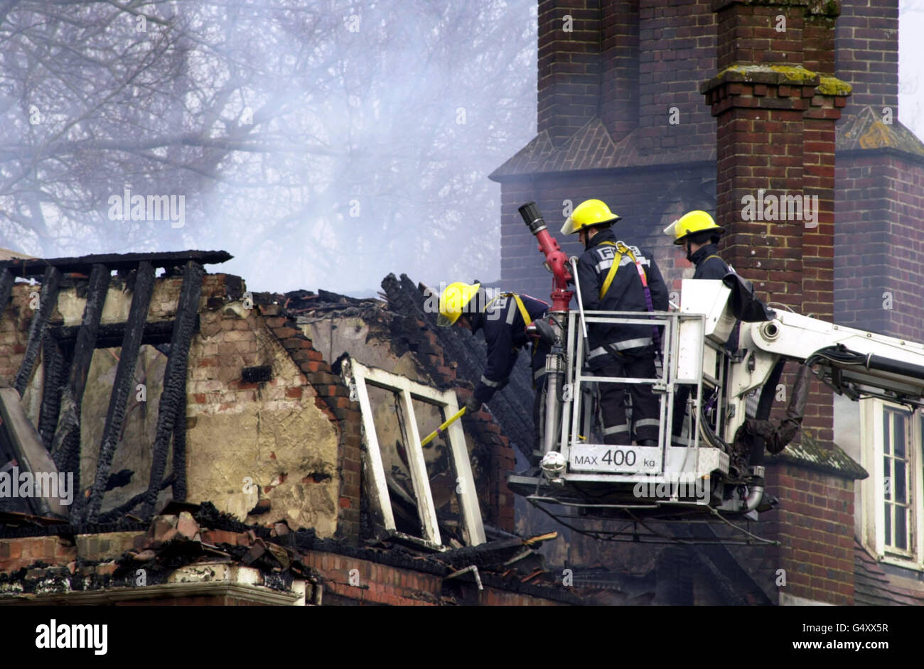 Firefighters at the home of Conservative MP Michael Colvin. Rescuers ...
