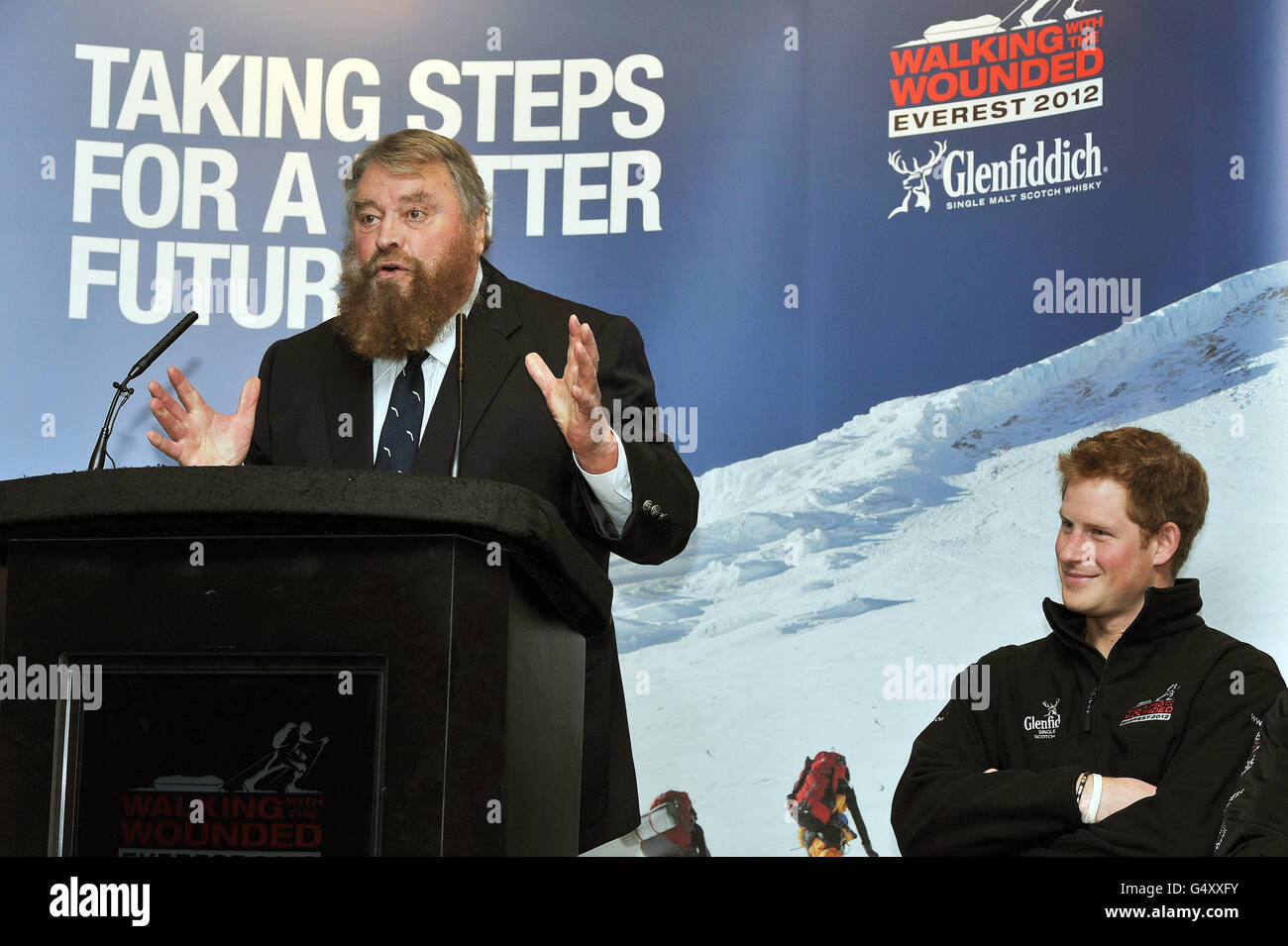 Prince harry listens hi-res stock photography and images - Alamy