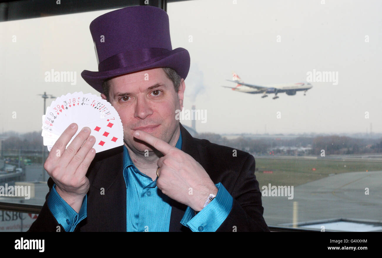 Magician Mike Stoner entertains passengers at the Crown Rivers bar in ...