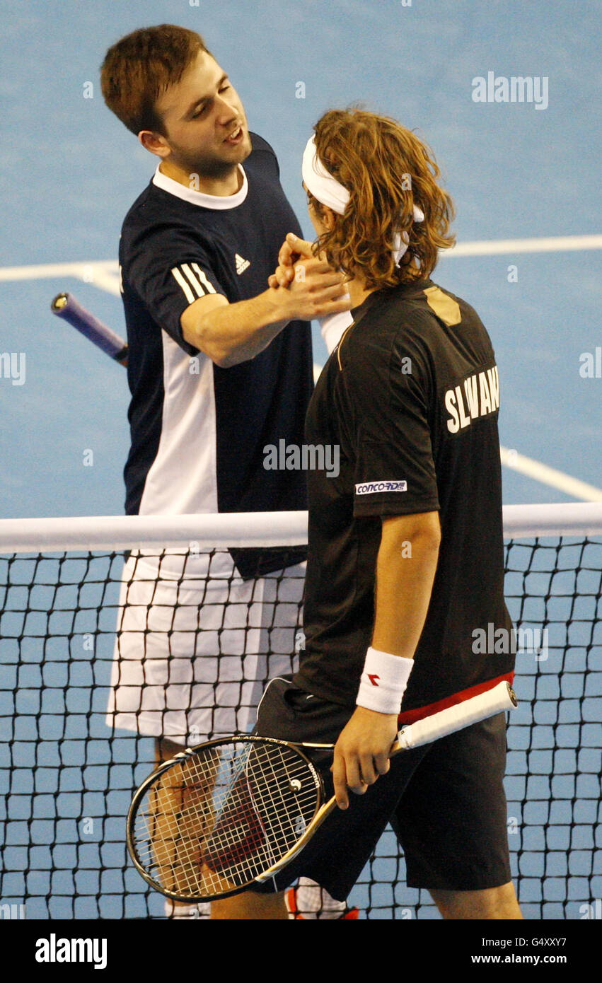 Great Britain's Dan Evans (left) and Lukas Lacko (right) shake hands ...