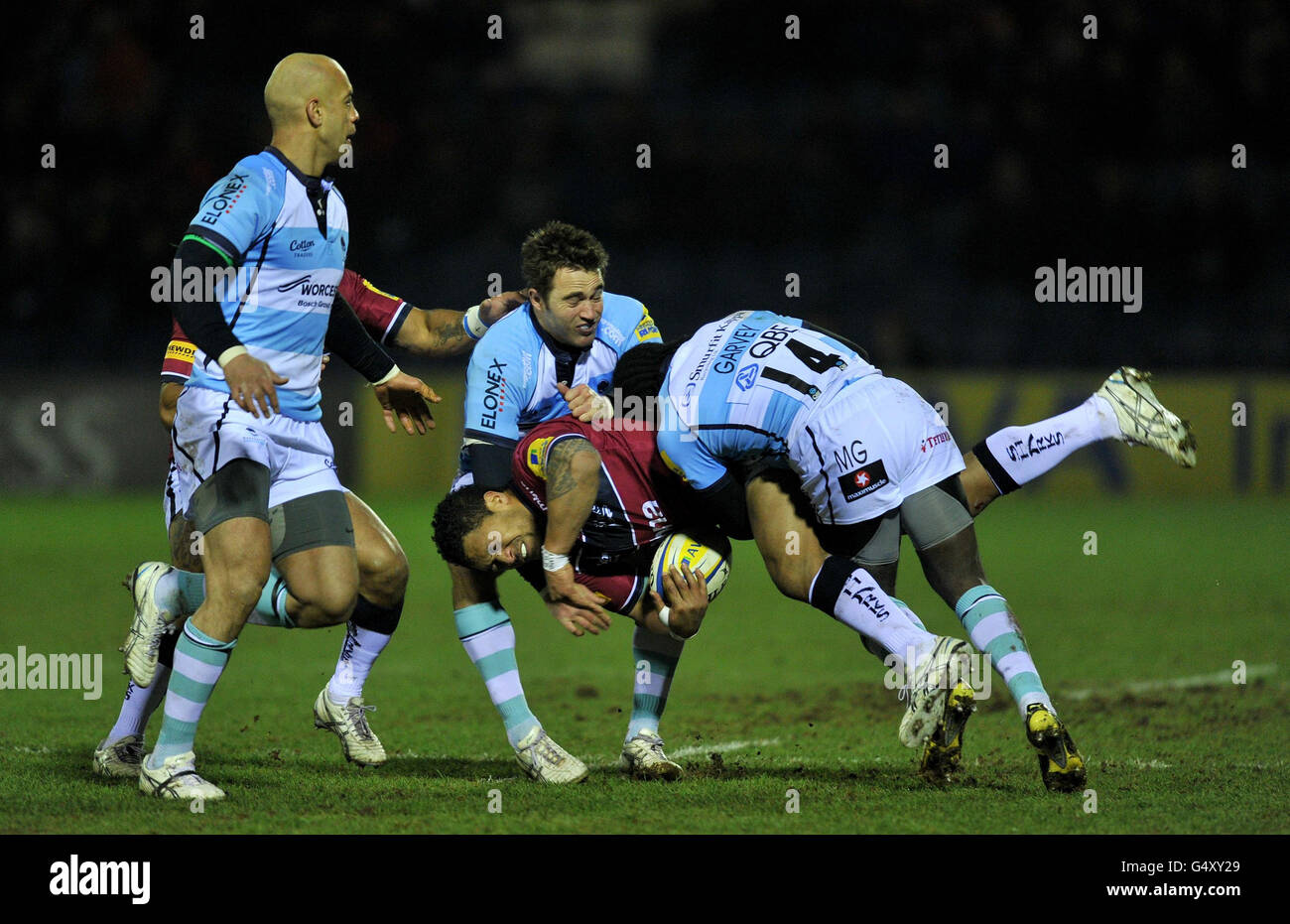 Sale sharks Johnny Leota is tackled by Worcester's Alex Grove (centre ...