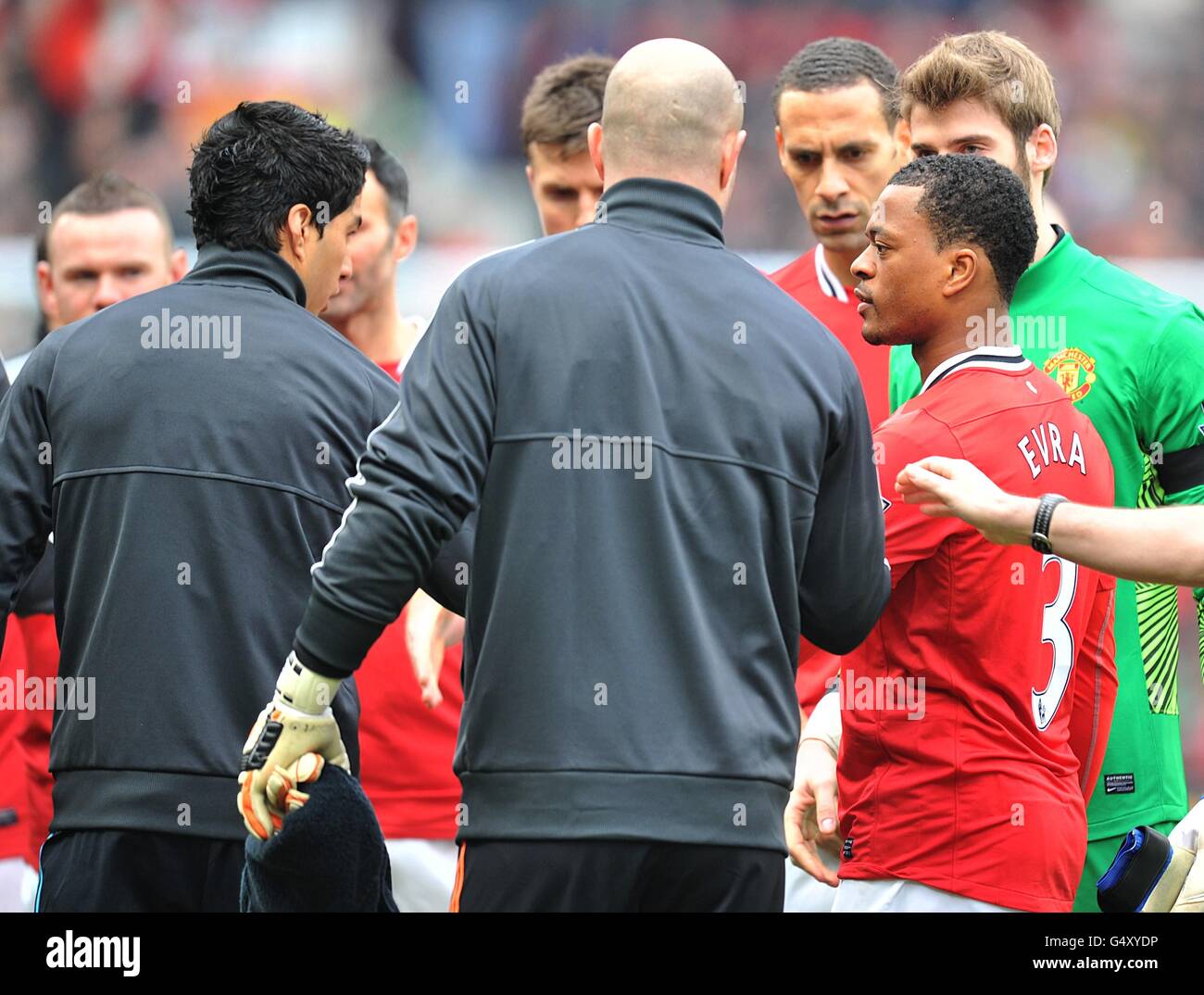 Liverpool's Luis Suarez (left) refuses to shake the hand of Manchester ...