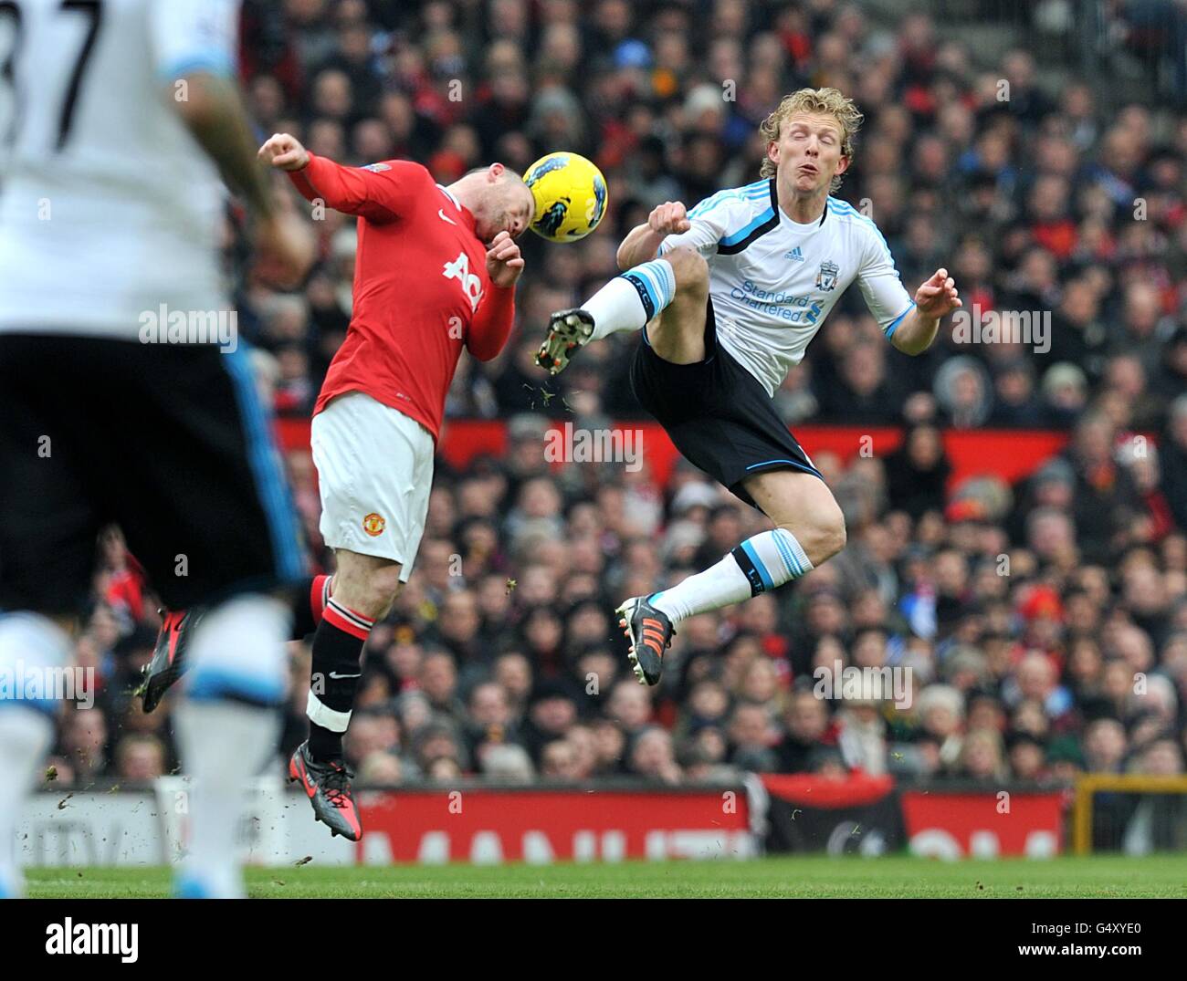 Manchester United's Wayne Rooney (left) and Liverpool's Dirk Kuyt ...