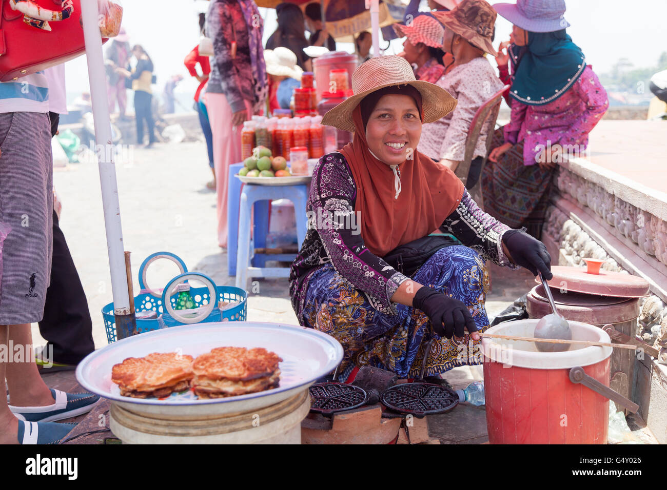 Cambodia, Kep, crabs market, woman selling waffles on the crabs market ...