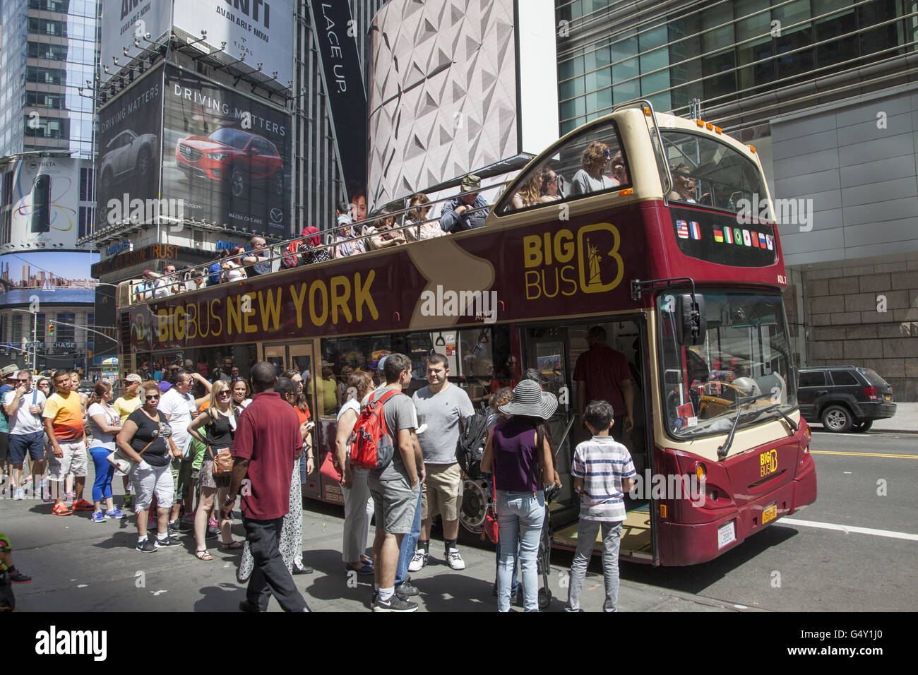 Double-decker tour bus on 42nd Street in Times Square, New York City ...