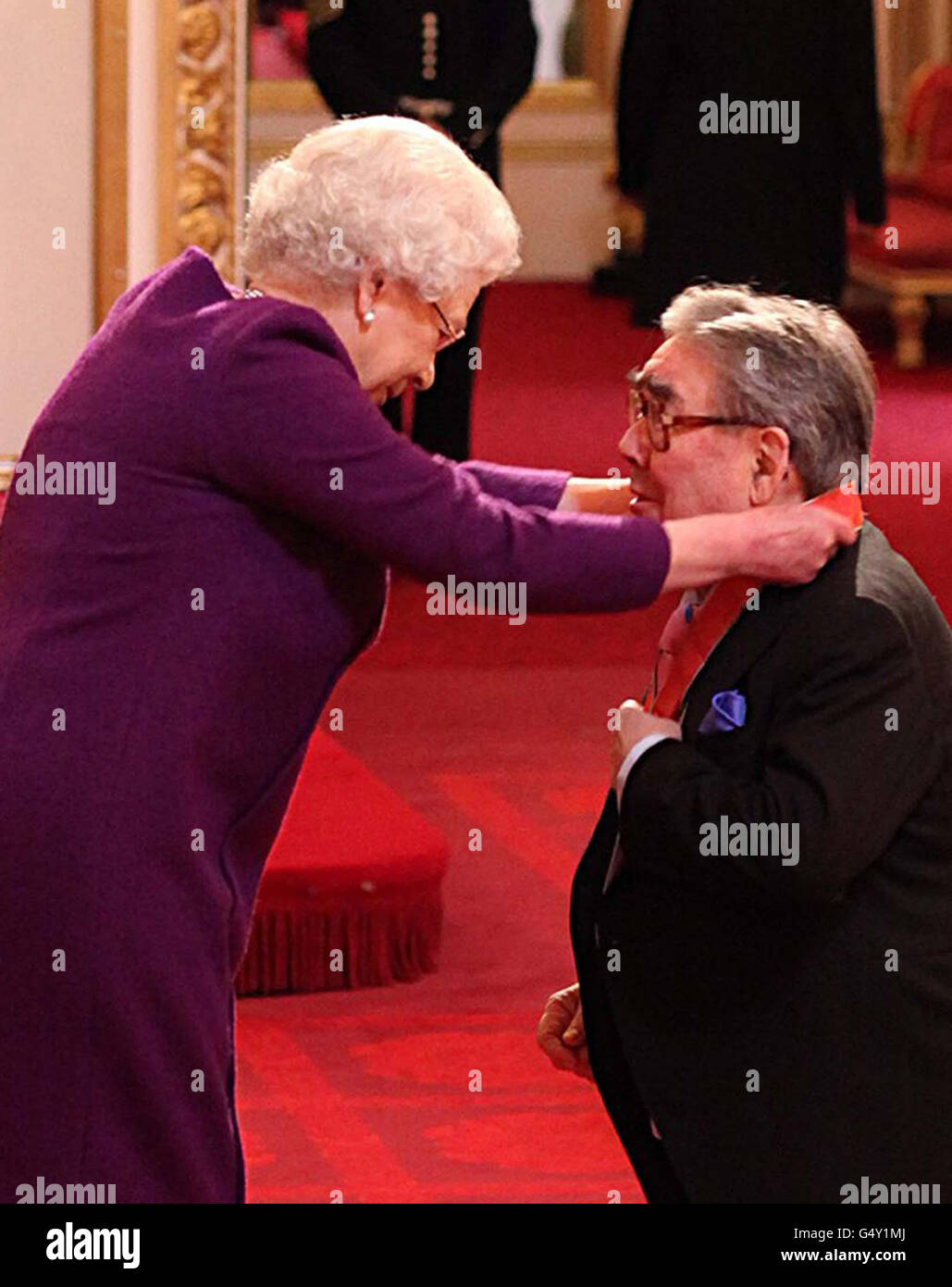 Queen Elizabeth II presents Ronnie Corbett with his Commander of the ...