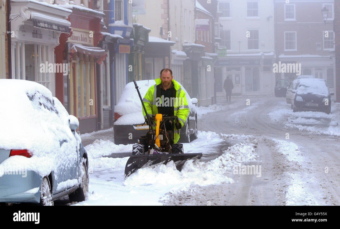 Howden Town Council worker Hugh Roberts uses a plough to clear snow ...